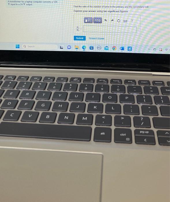 Solved A transformer for a laptop computer converts a 120- V | Chegg.com