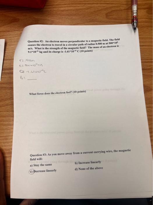 Solved Question in2: An electron moves perpendicular to a | Chegg.com