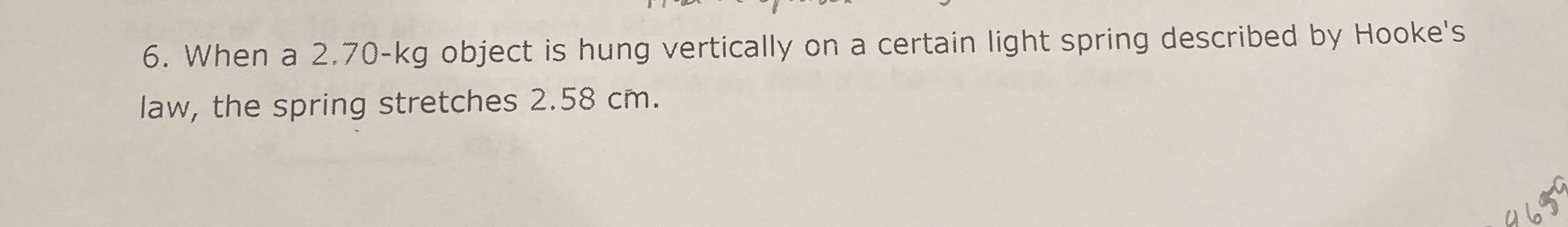 Solved When a 2.70-kg ﻿object is hung vertically on a | Chegg.com