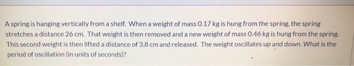 Solved A spring is hanging vertically from a shelf. When a | Chegg.com
