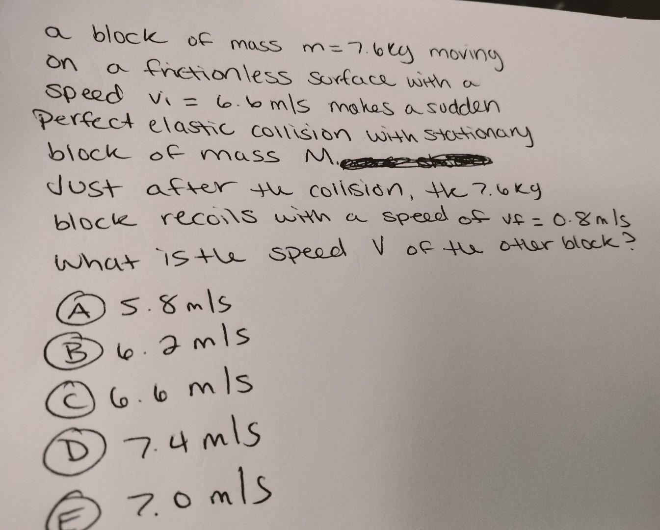 Solved a block of mass m=7.6 kg moving on a frictionless | Chegg.com