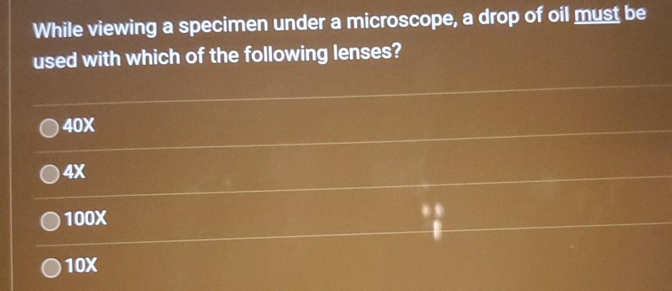 Solved While viewing a specimen under a microscope, a drop | Chegg.com