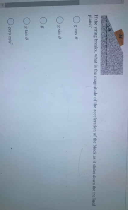 Solved A block of mass M is held motionless on a | Chegg.com