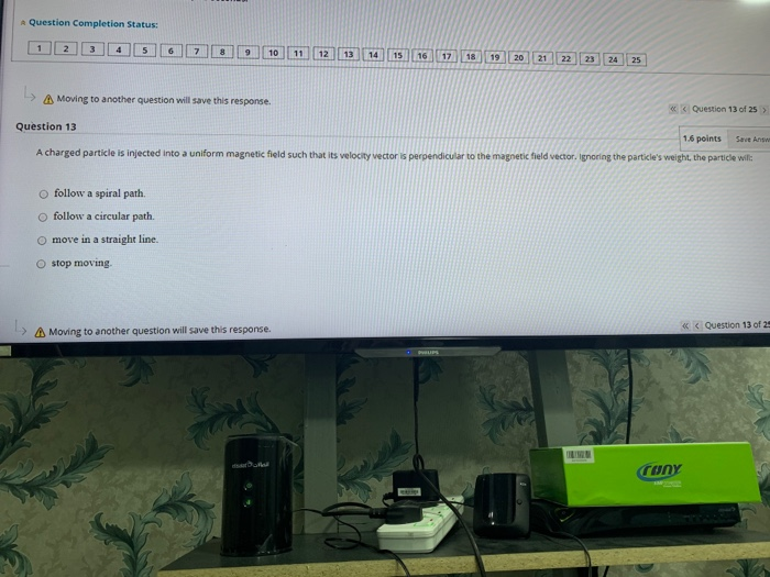 Solved a charged particle is injected into a uniform | Chegg.com