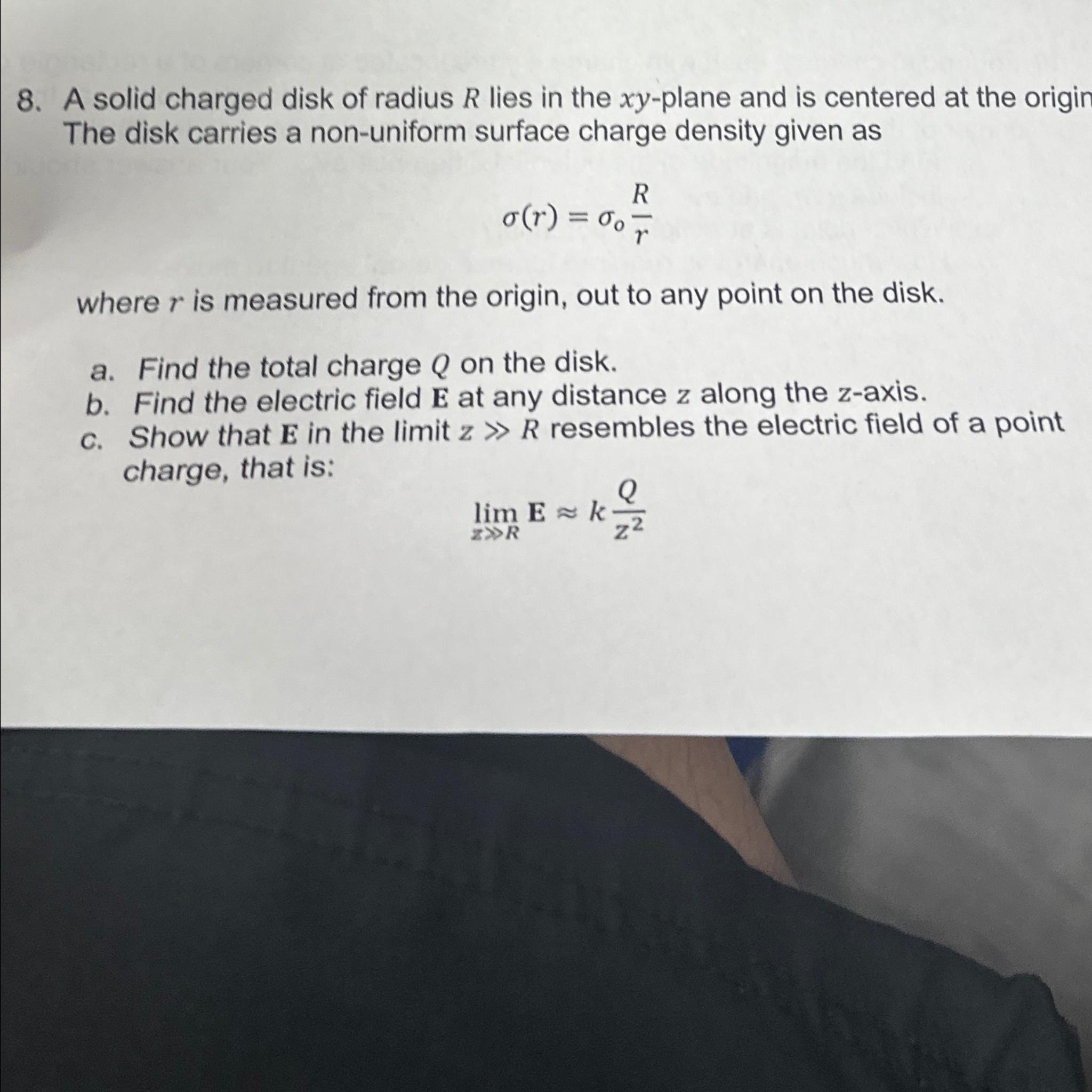Solved A solid charged disk of radius R ﻿lies in the | Chegg.com