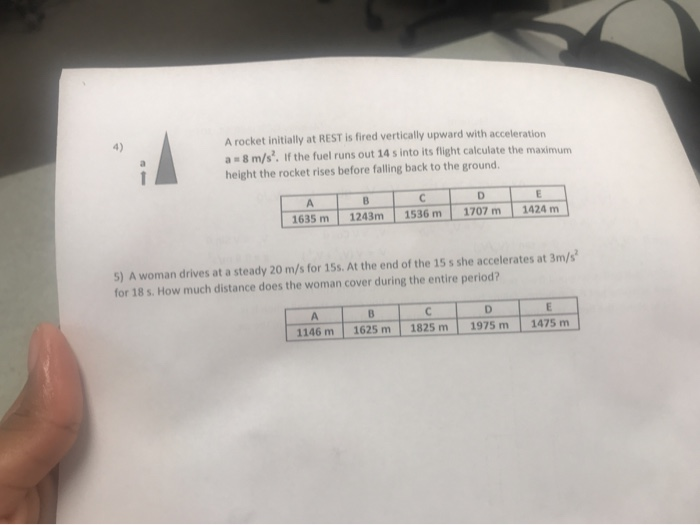 Solved A rocket initially at REST is fired vertically upward | Chegg.com