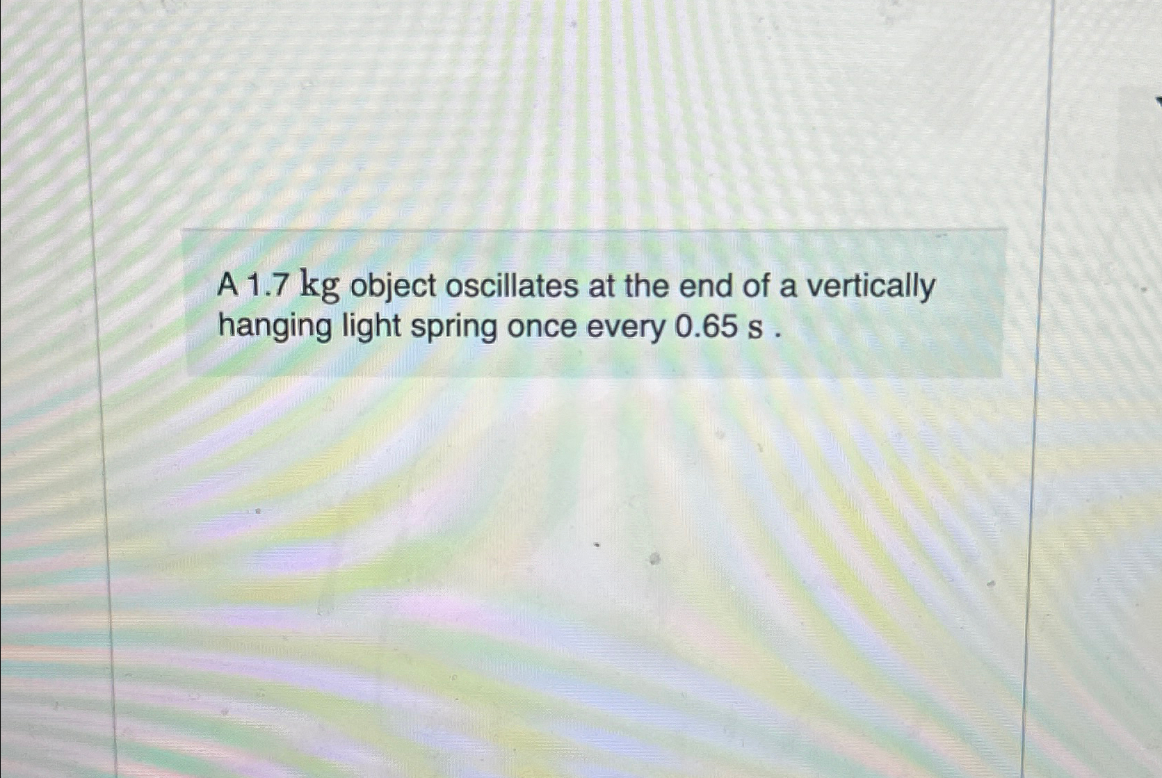 Solved A 1.7kg ﻿object oscillates at the end of a vertically | Chegg.com