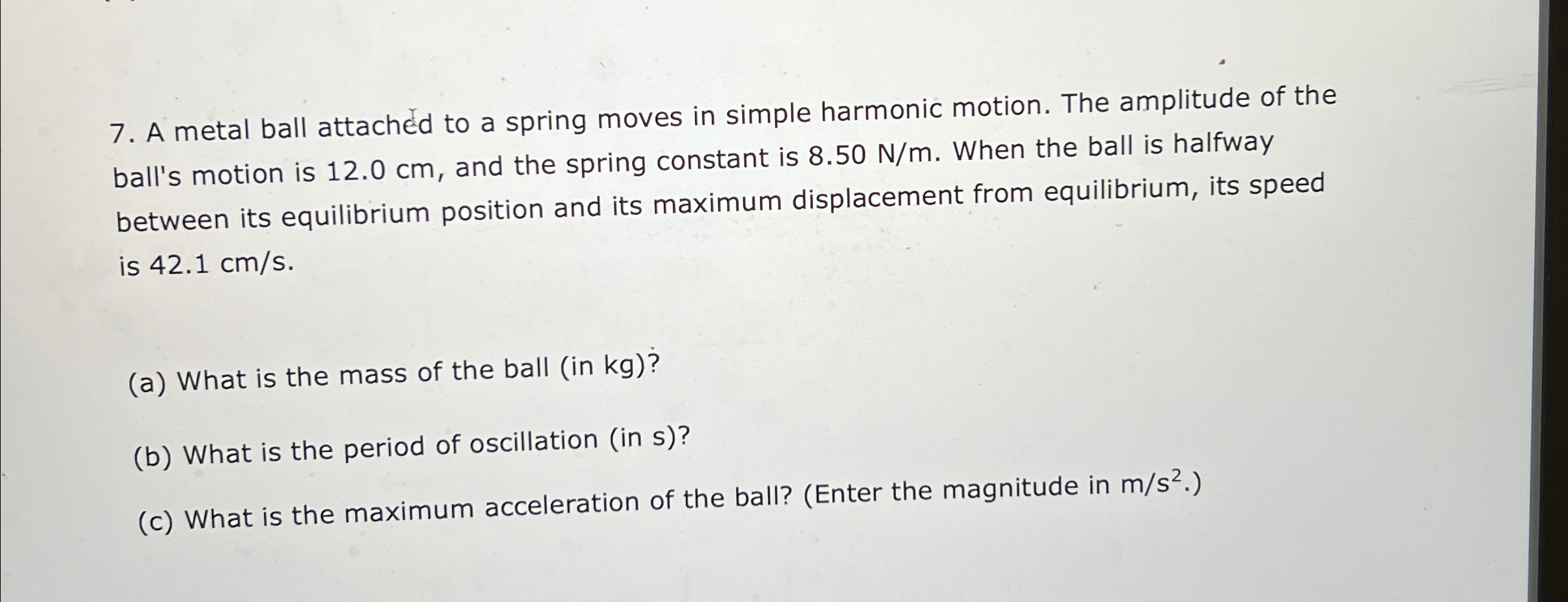 Solved A metal ball attached to a spring moves in simple | Chegg.com