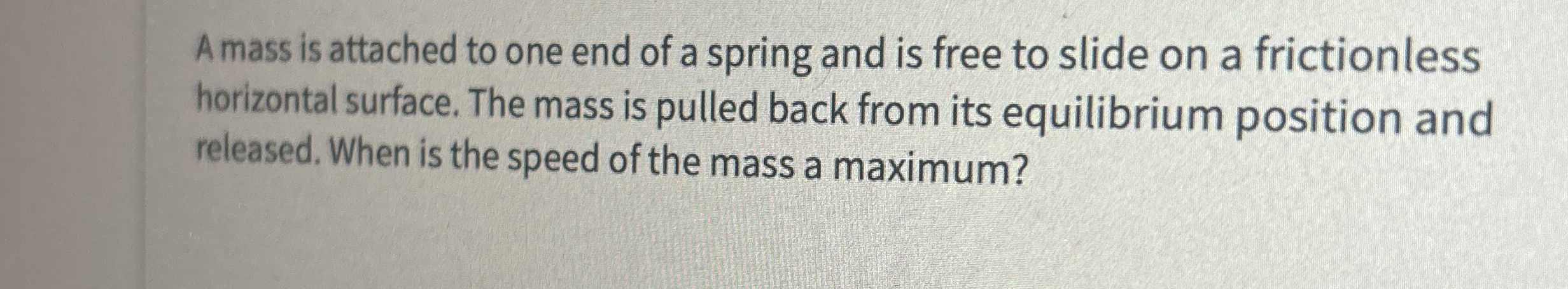 Solved A mass is attached to one end of a spring and is free | Chegg.com