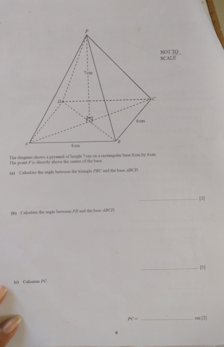 Solved The diagran shows a pyramid of height 7cm ﻿on a | Chegg.com