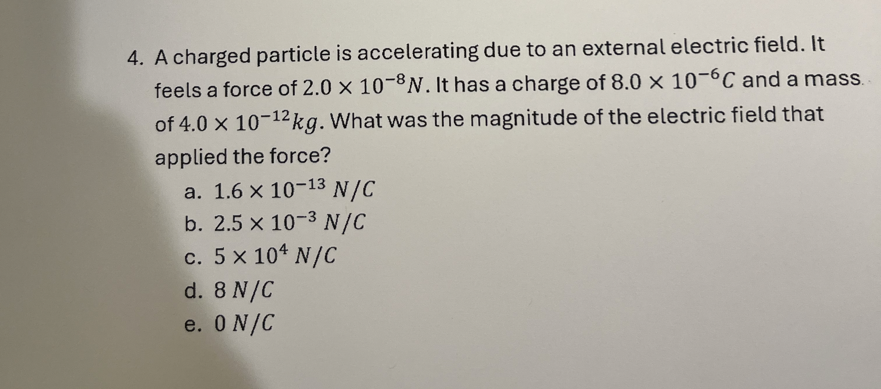 Solved A charged particle is accelerating due to an external | Chegg.com