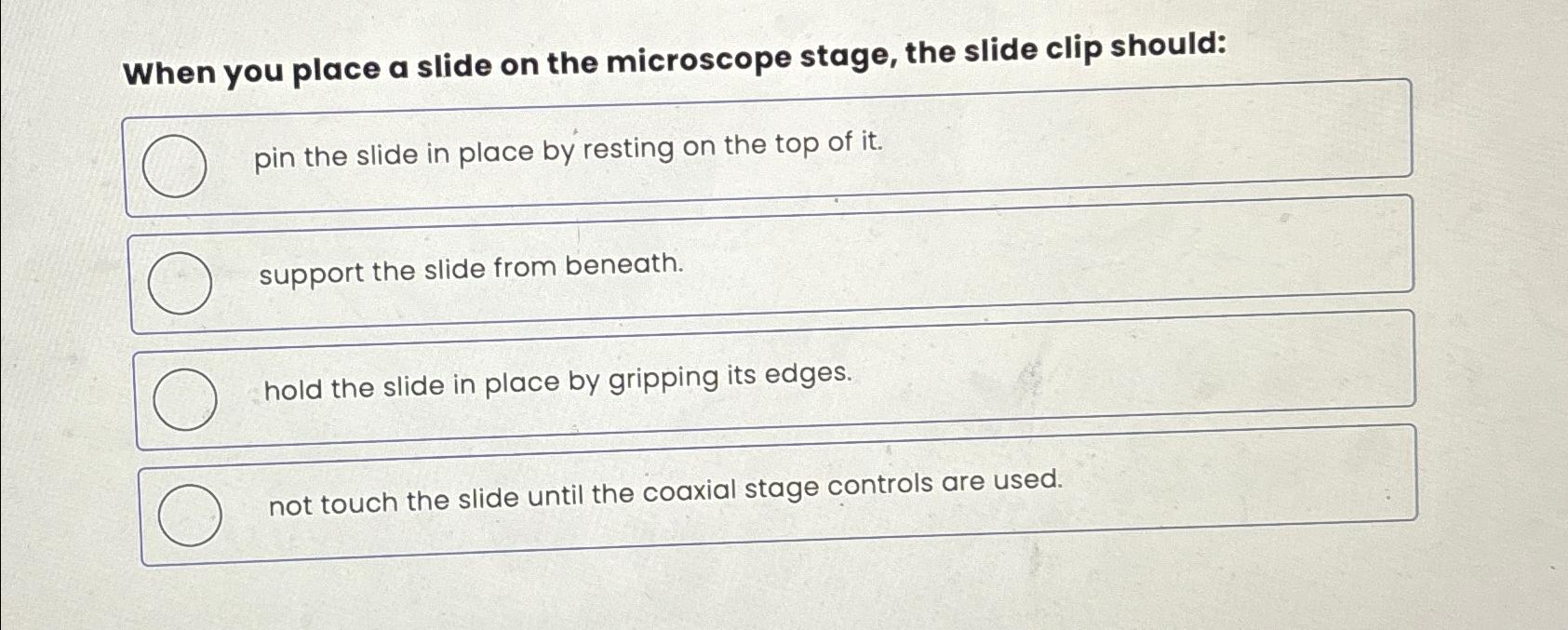 Solved When you place a slide on the microscope stage, the | Chegg.com