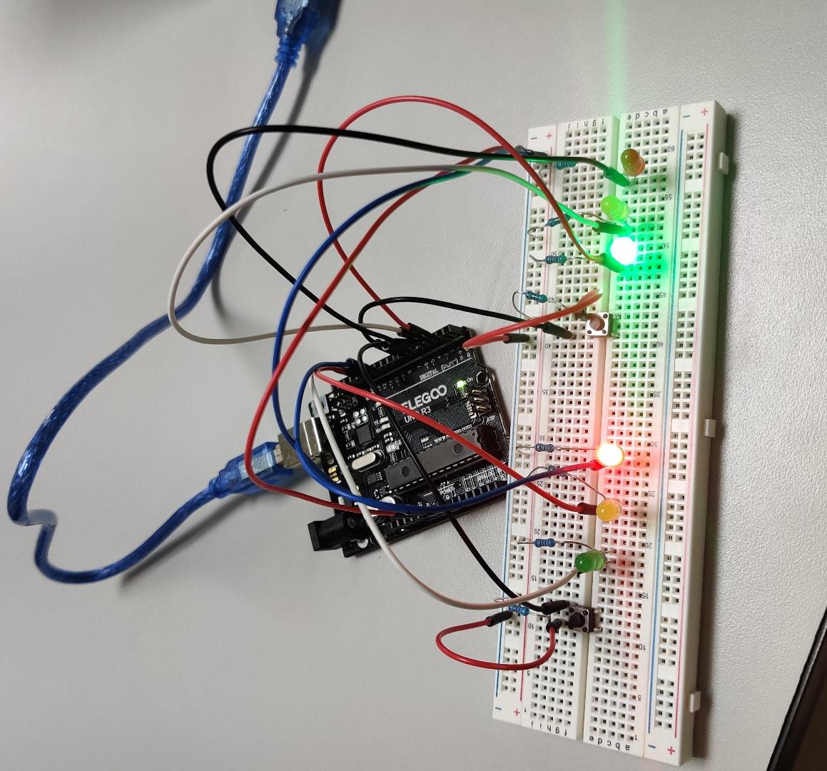 Solved Objective: To design, build, and program a traffic | Chegg.com