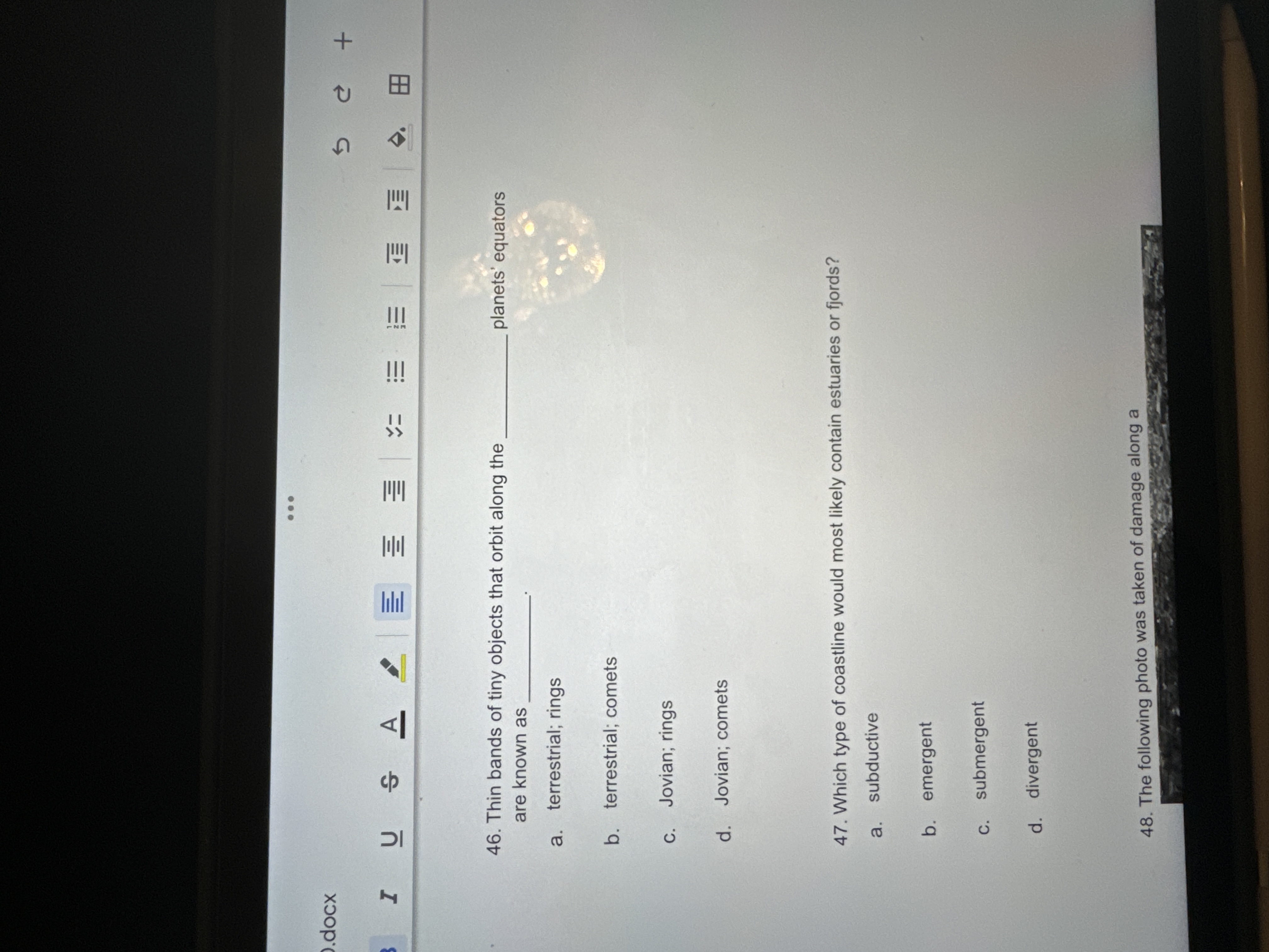 Solved Thin bands of tiny objects that orbit along | Chegg.com