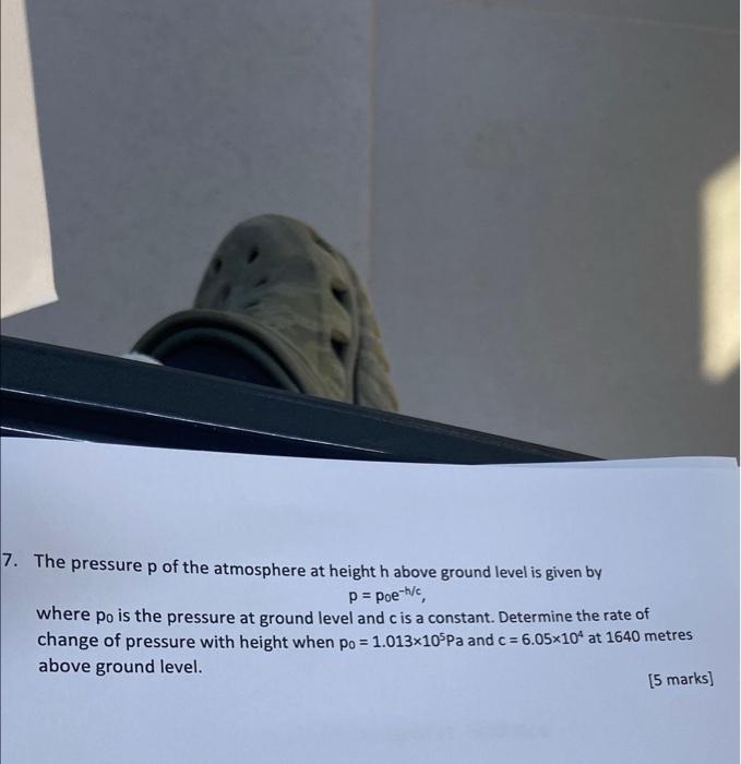 Solved 7. The pressure p of the atmosphere at height h above | Chegg.com