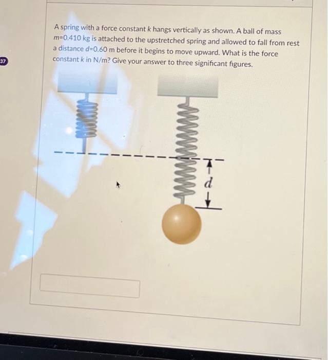Solved 37 A spring with a force constant k hangs vertically | Chegg.com