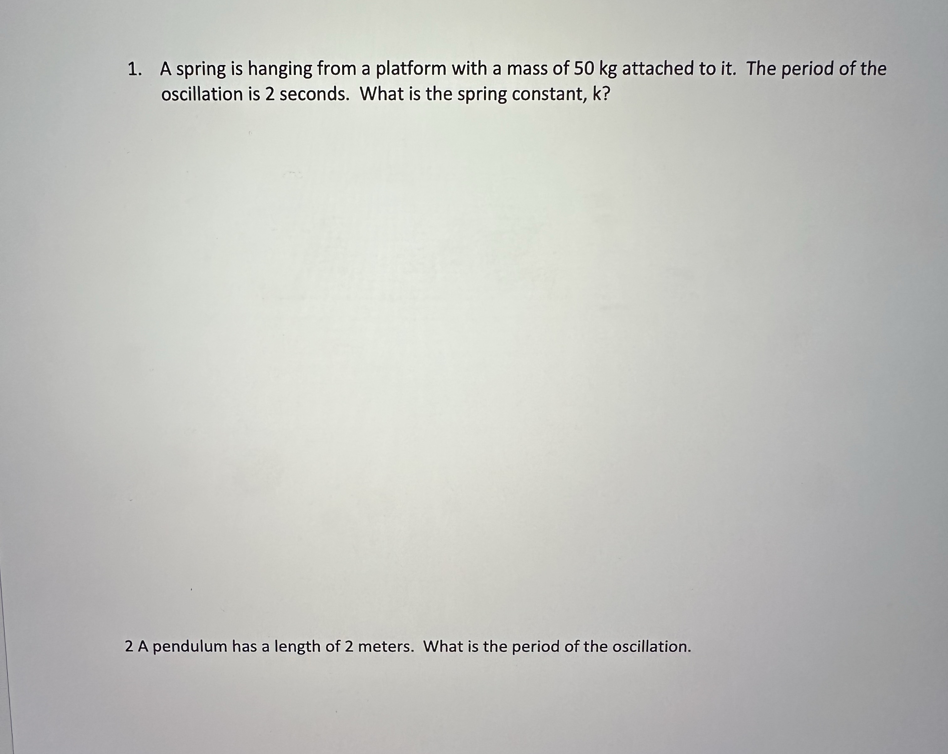 Solved 1. ﻿A spring is hanging from a platform with a mass | Chegg.com