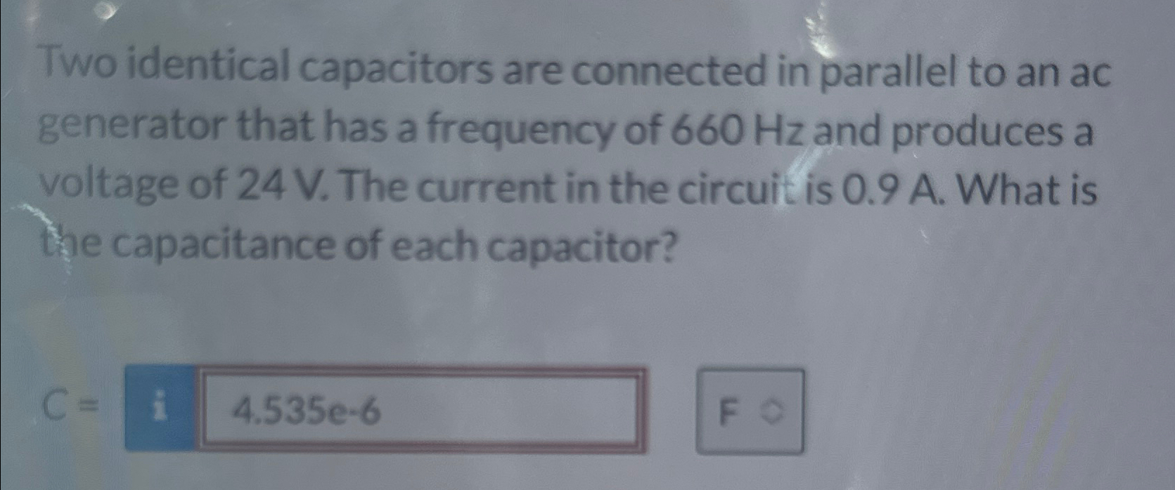 Solved Two identical capacitors are connected in parallel to | Chegg.com