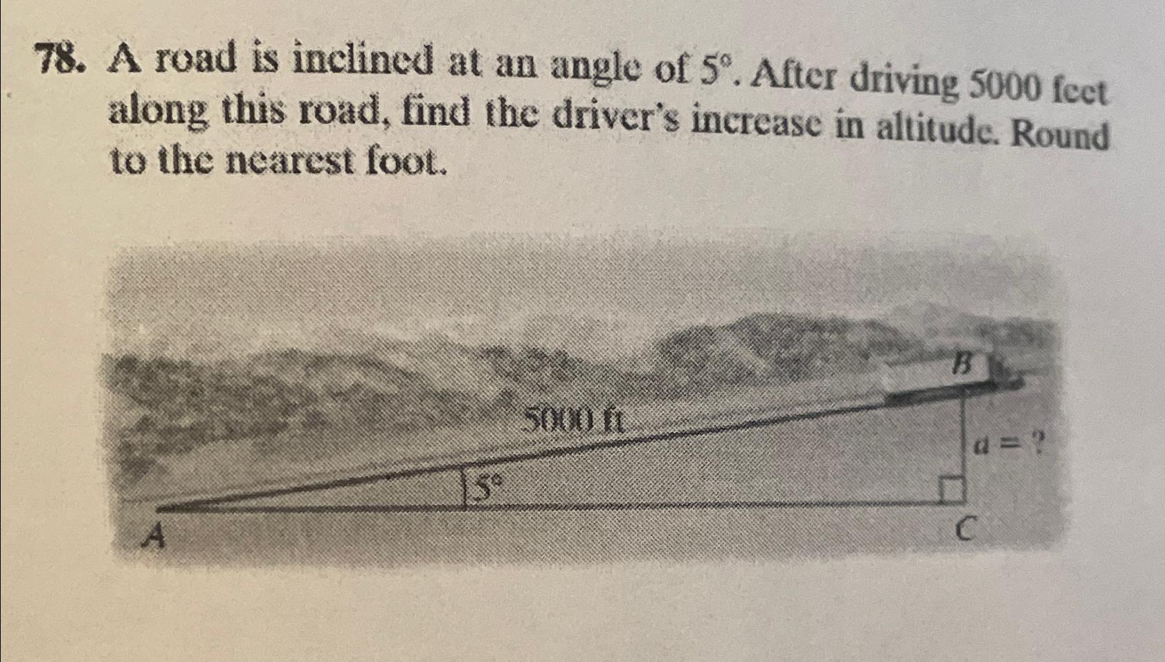 Solved A road is inclined at an angle of 5°. ﻿After driving | Chegg.com