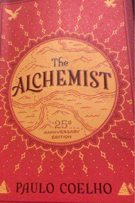 1A) In the Alchemist (25th edtion) how does Santiago | Chegg.com