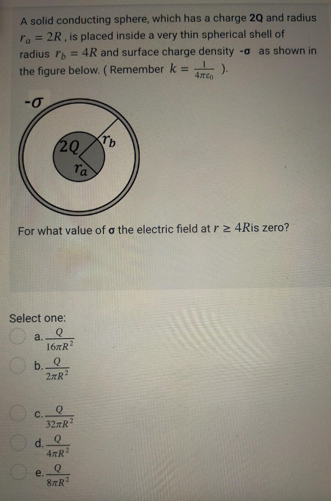 Solved A solid conducting sphere, which has a charge 2Q and | Chegg.com