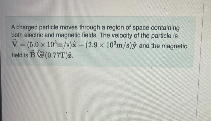 Solved A charged particle moves through a region of space | Chegg.com