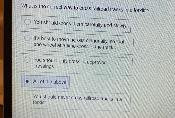 Solved What is the correct way to cross railroad tracks in a | Chegg.com