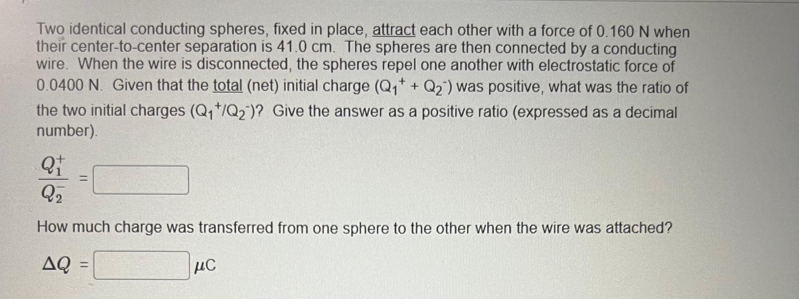 Solved Two identical conducting spheres, fixed in place, | Chegg.com