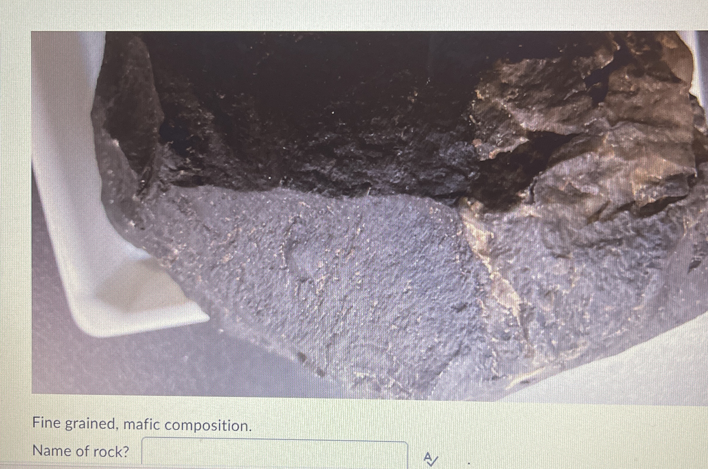 Fine grained, mafic composition.Name of rock? | Chegg.com