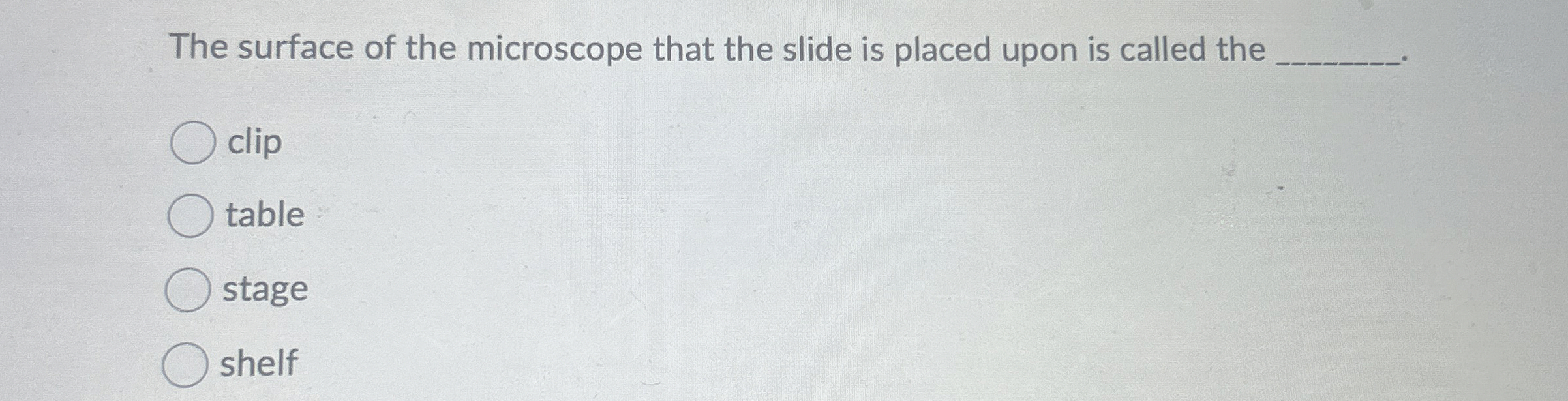 Solved The surface of the microscope that the slide is | Chegg.com