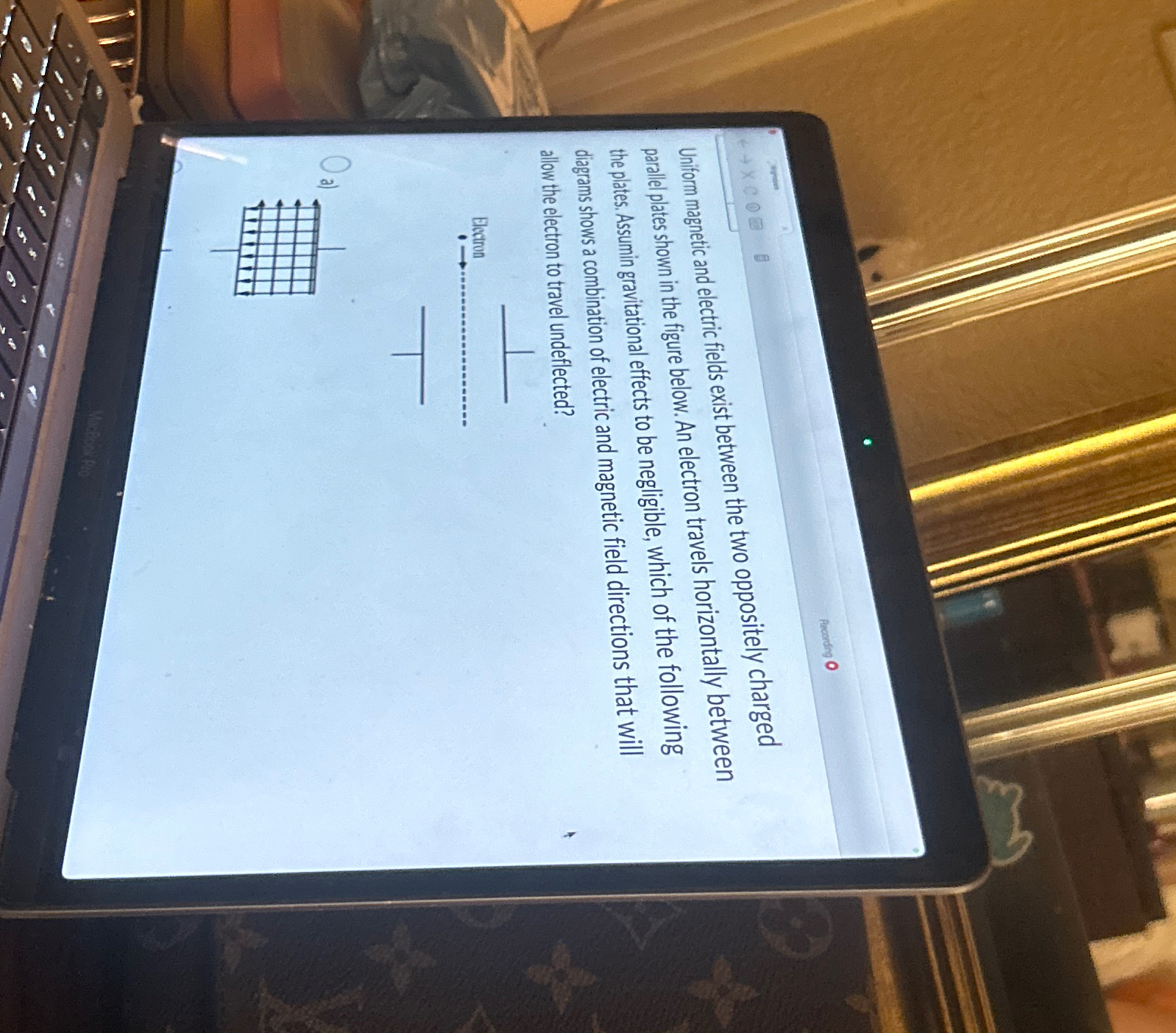 Solved Uniform magnetic and electric fields exist between | Chegg.com