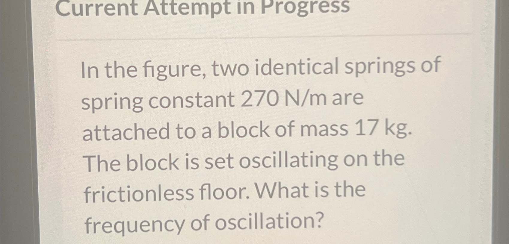 Solved In the figure, two identical springs of spring | Chegg.com