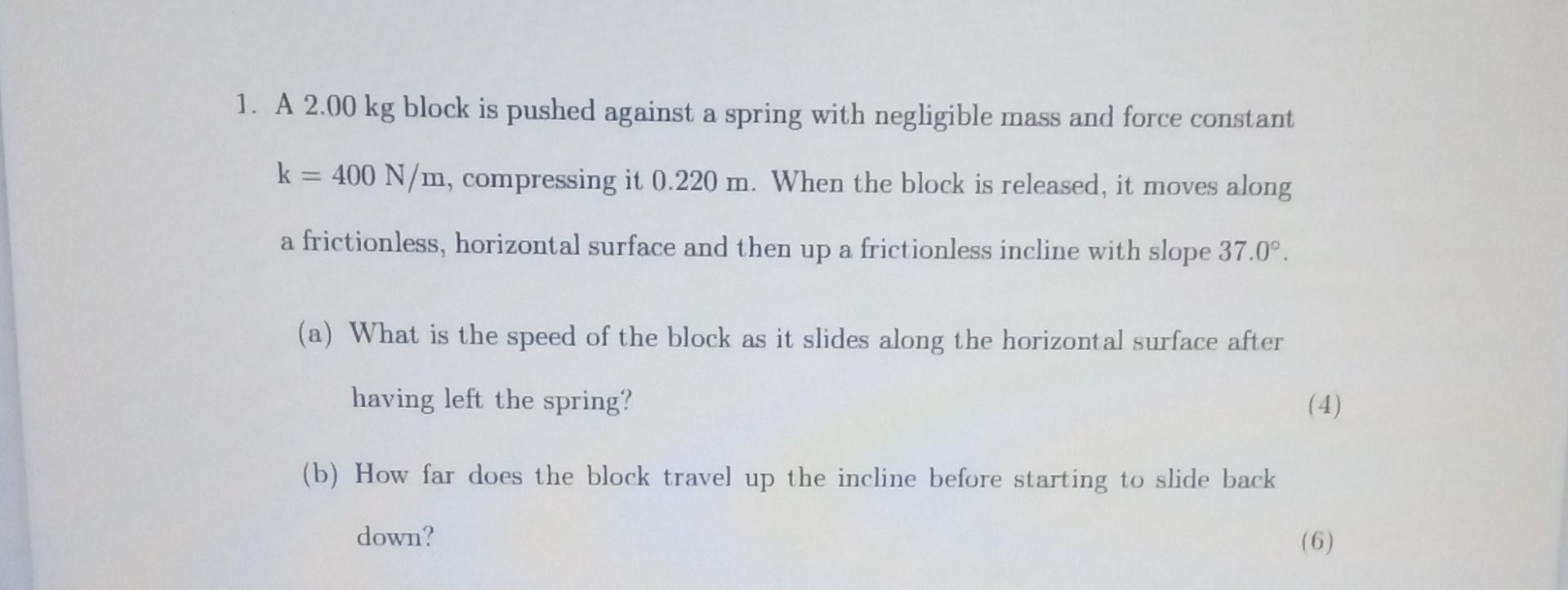 Solved 1. A 2.00 kg block is pushed against a spring with | Chegg.com