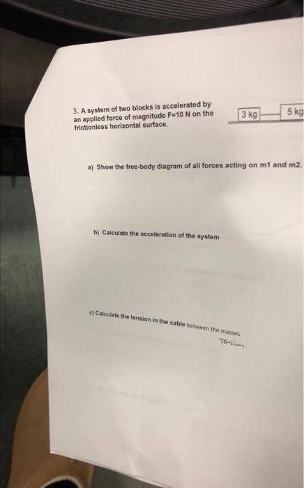 Solved 3. A system of two blocks is accelerated by an | Chegg.com