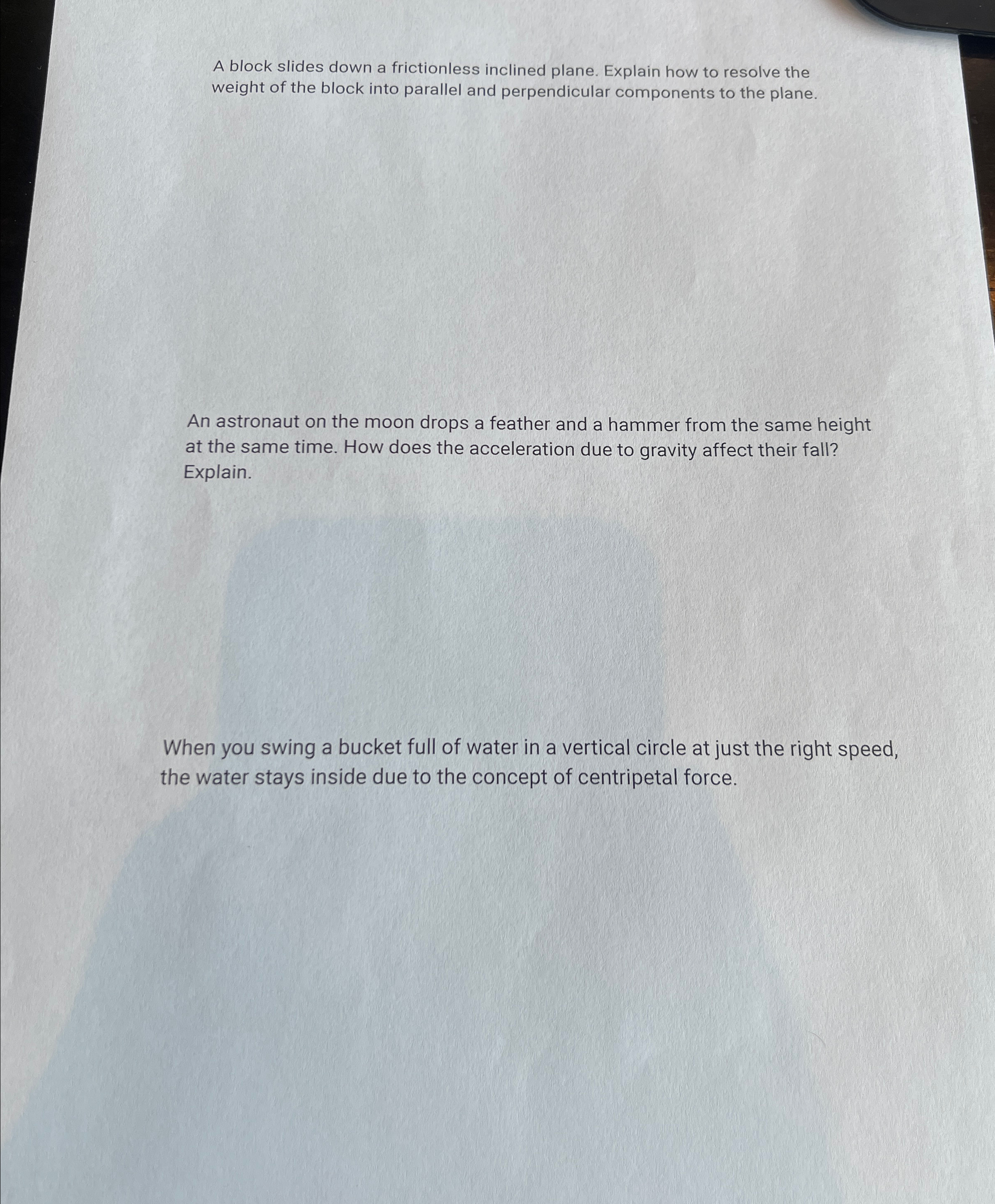 Solved A block slides down a frictionless inclined plane. | Chegg.com