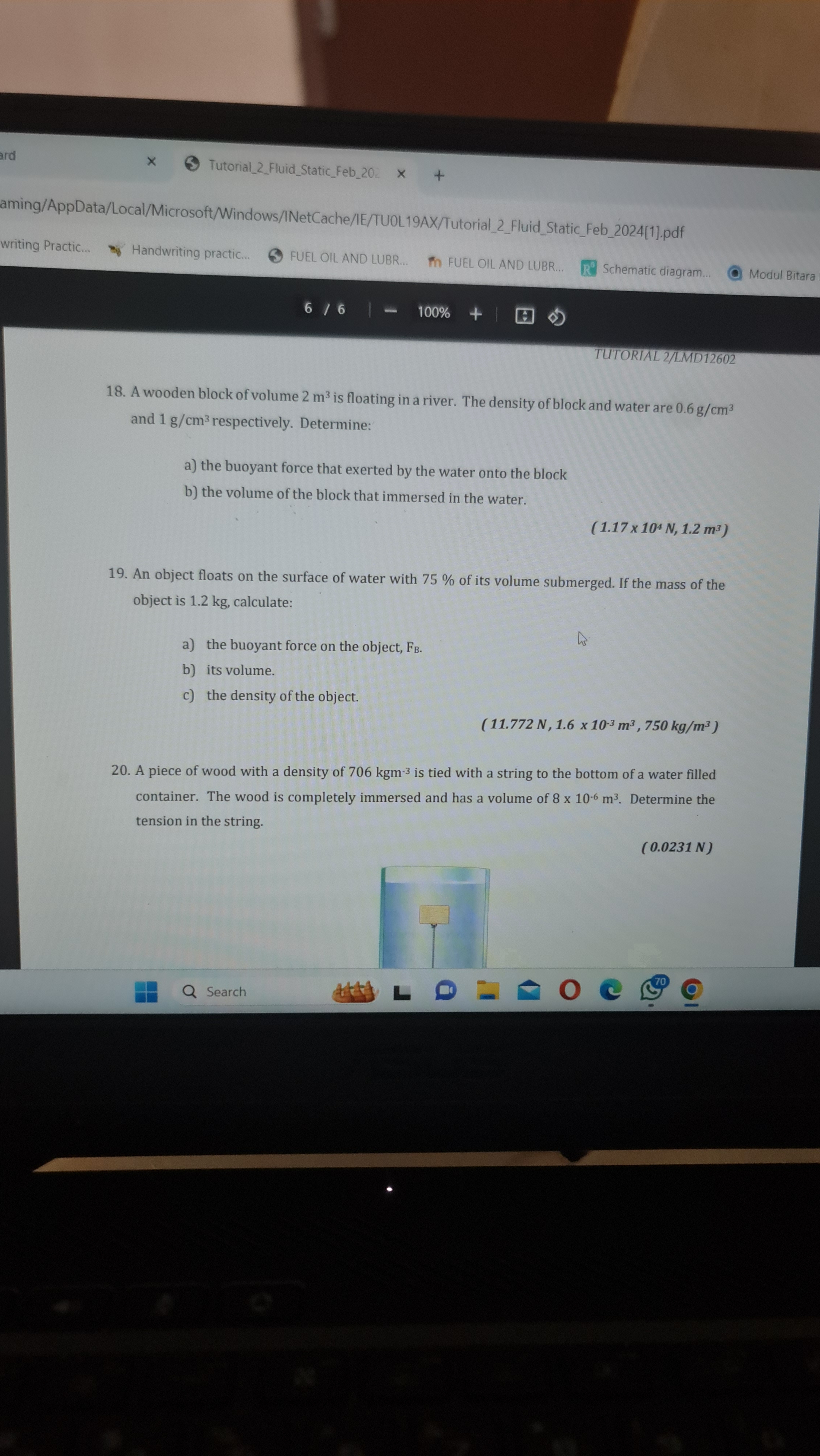 Solved A wooden block of volume 2m3 ﻿is floating in a river. | Chegg.com