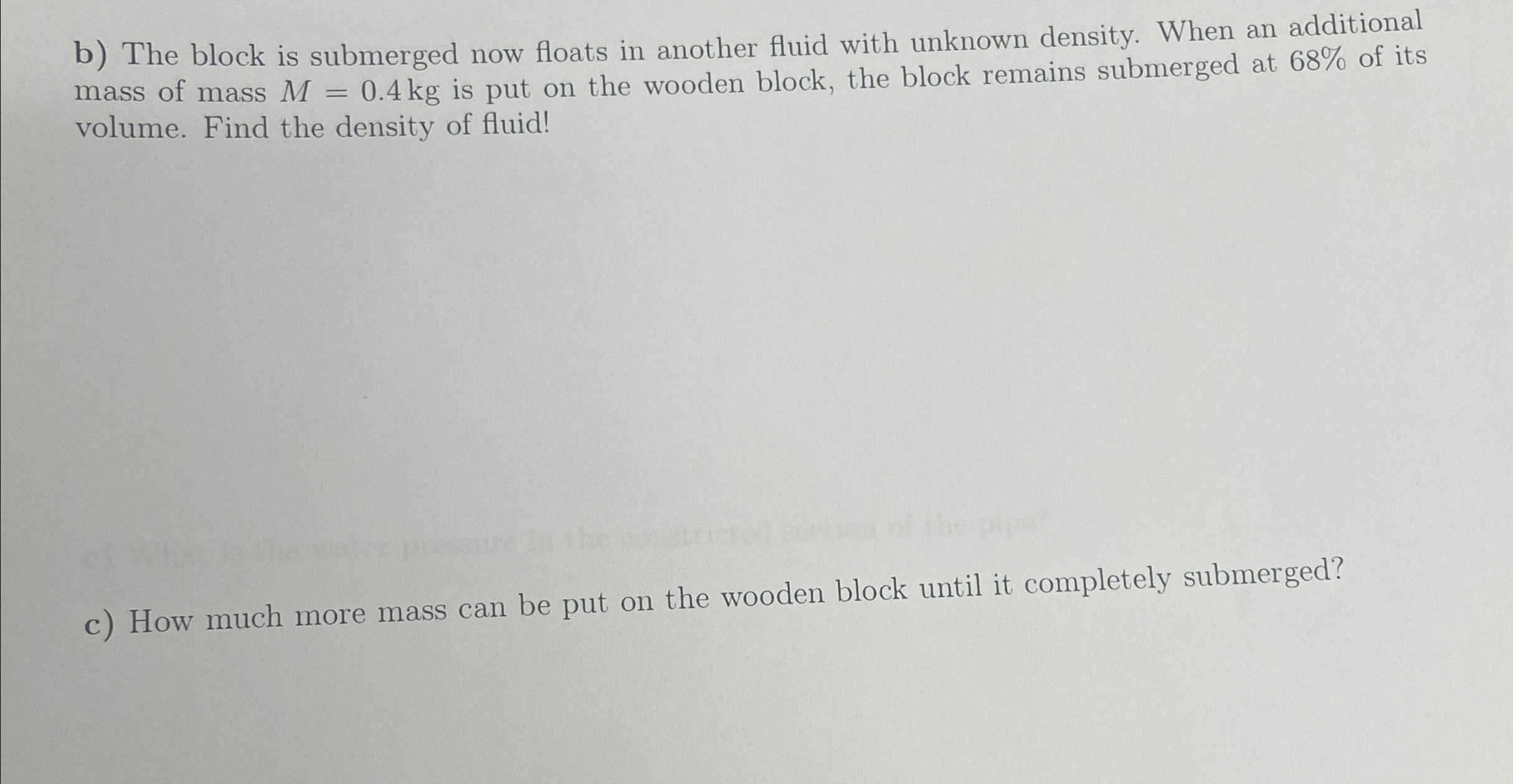 Solved b) ﻿The block is submerged now floats in another | Chegg.com