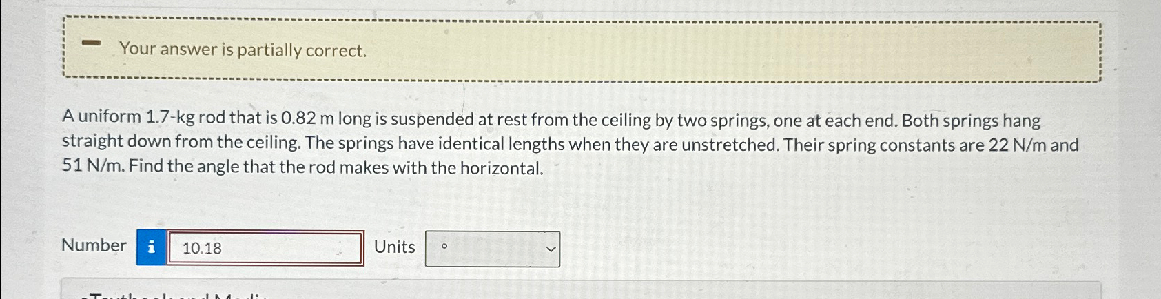 Solved Your answer is partially correct.A uniform 1.7-kg | Chegg.com