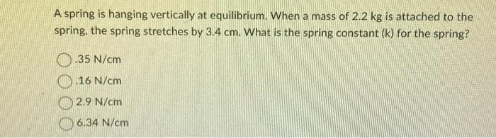 Solved A spring is hanging vertically at equilibrium. When a | Chegg.com