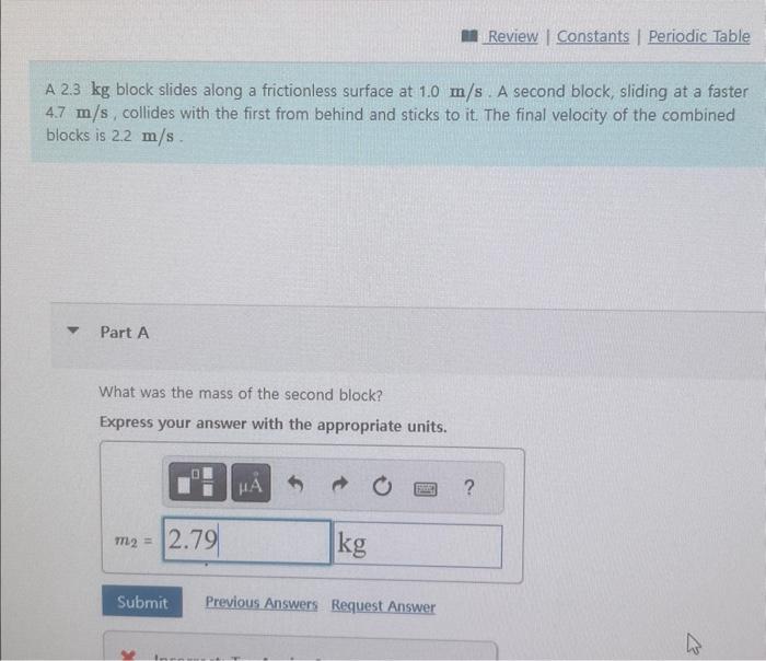 Solved A 2.3 kg block slides along a frictionless surface at | Chegg.com