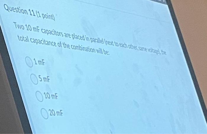 Solved Twio 10 inf capacitors are placed in parallel hext to | Chegg.com