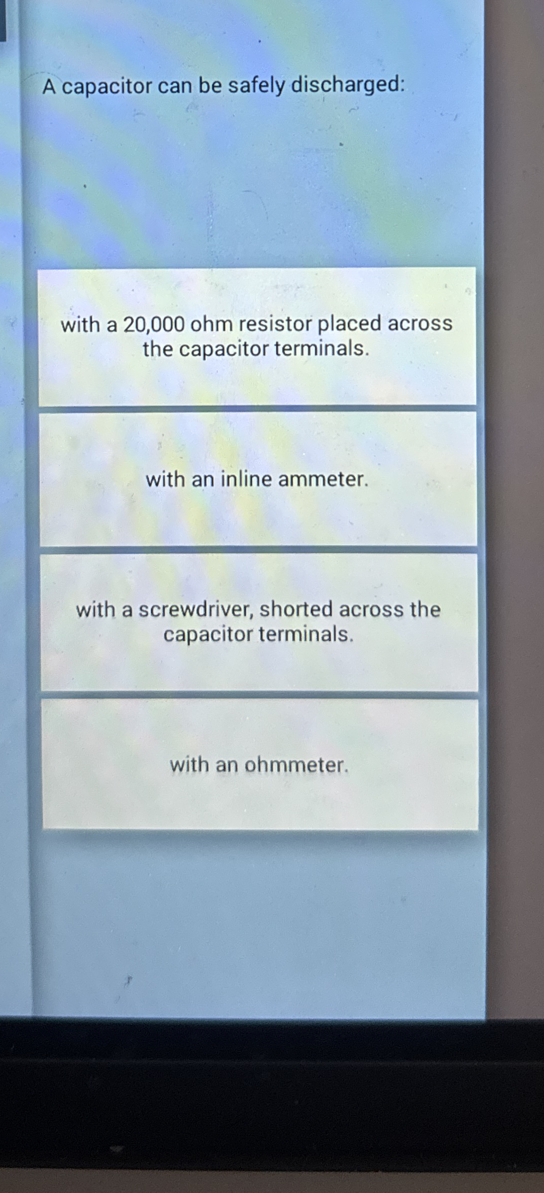 A capacitor can be safely discharged:with a 20,000 | Chegg.com