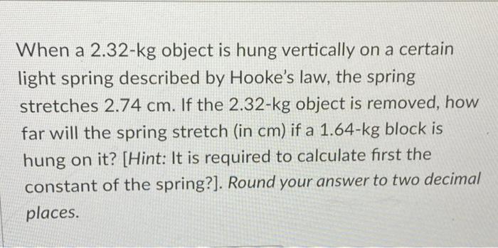 Solved When a 2.32-kg object is hung vertically on a certain | Chegg.com