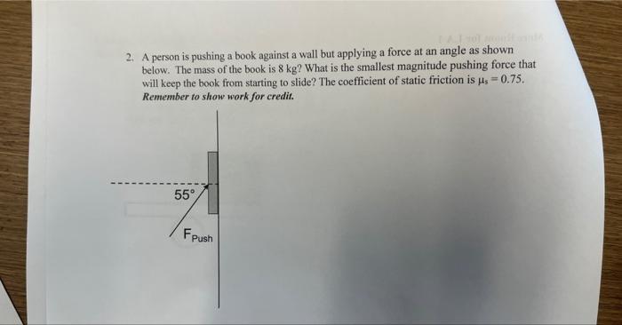 Solved 2. A person is pushing a book against a wall but | Chegg.com